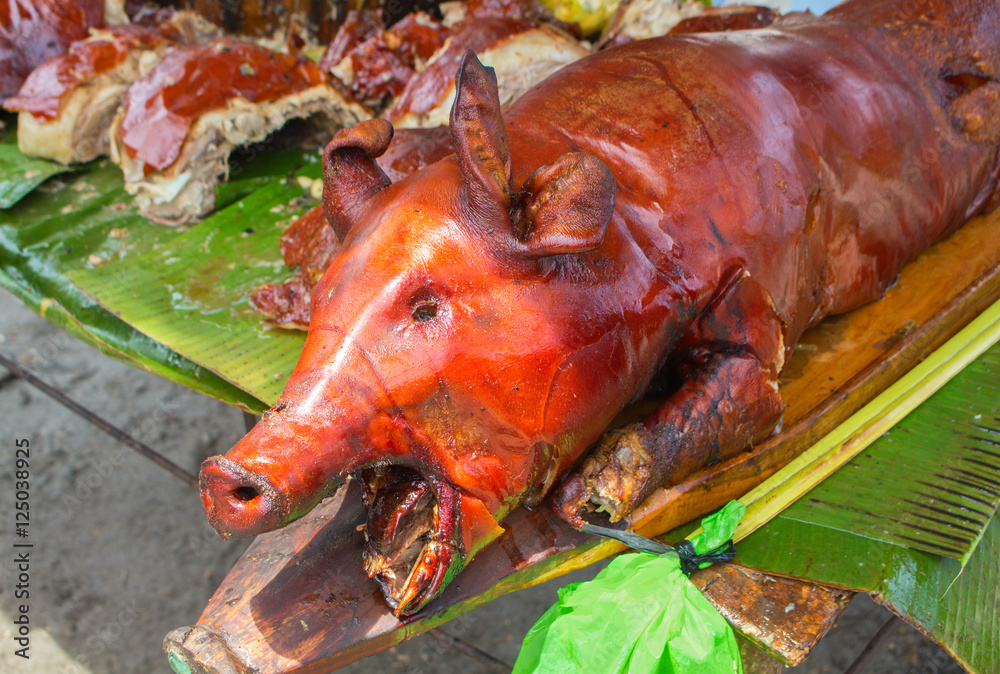 Barbecue pork on green table. Lechon or liempo - traditional dish of ...