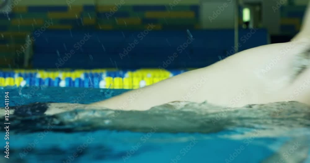 expert swimmer trains at the pool before a race, swimming keeps you fit ...
