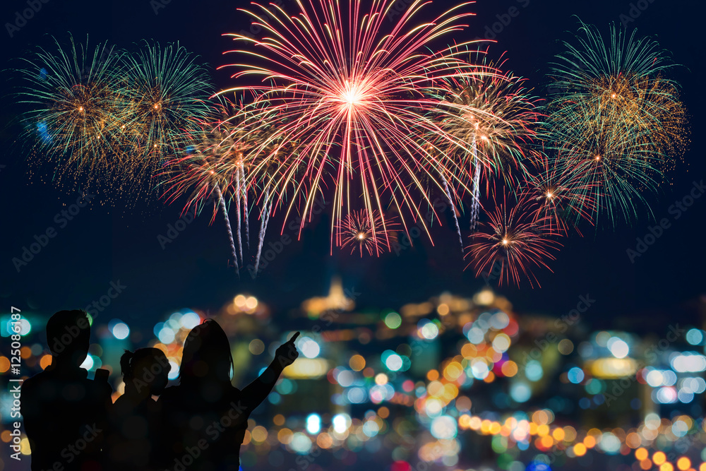 The happy family looks celebration fireworks in the night sky Stock ...