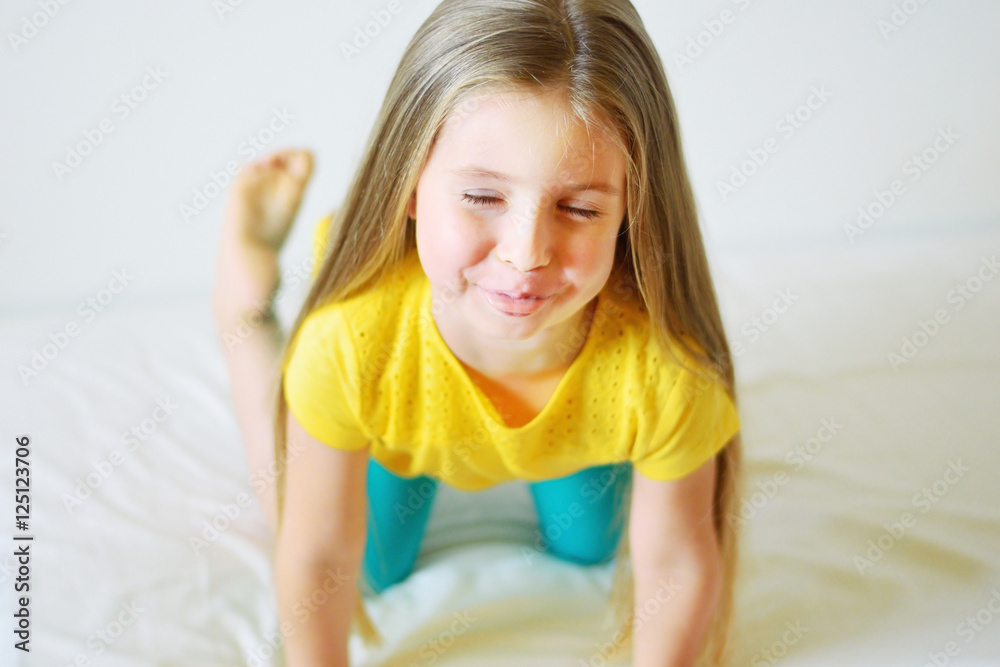 Adorable little girl showing tongue Stock Photo | Adobe Stock