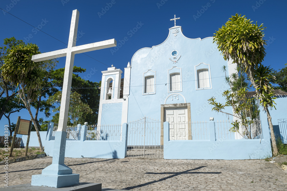 Traditional colonial church architecture with simple Christian cross on ...