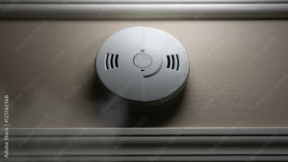 Smoke and fire trigger a home s smoke alarm sending out a series of ...