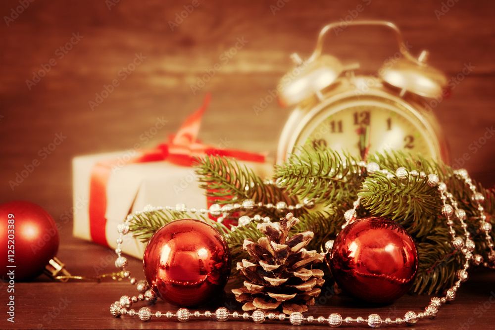 Christmas decoration with retro alarm clock, Santa Claus hat, baubles ...