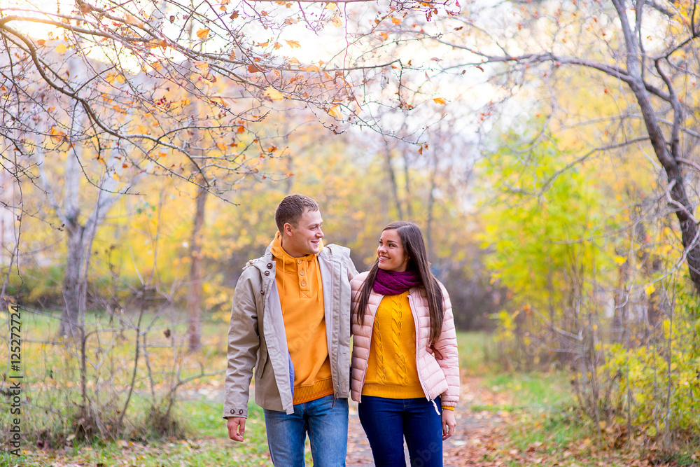 smiling couple hugging in autumn park from front Stock Photo | Adobe Stock