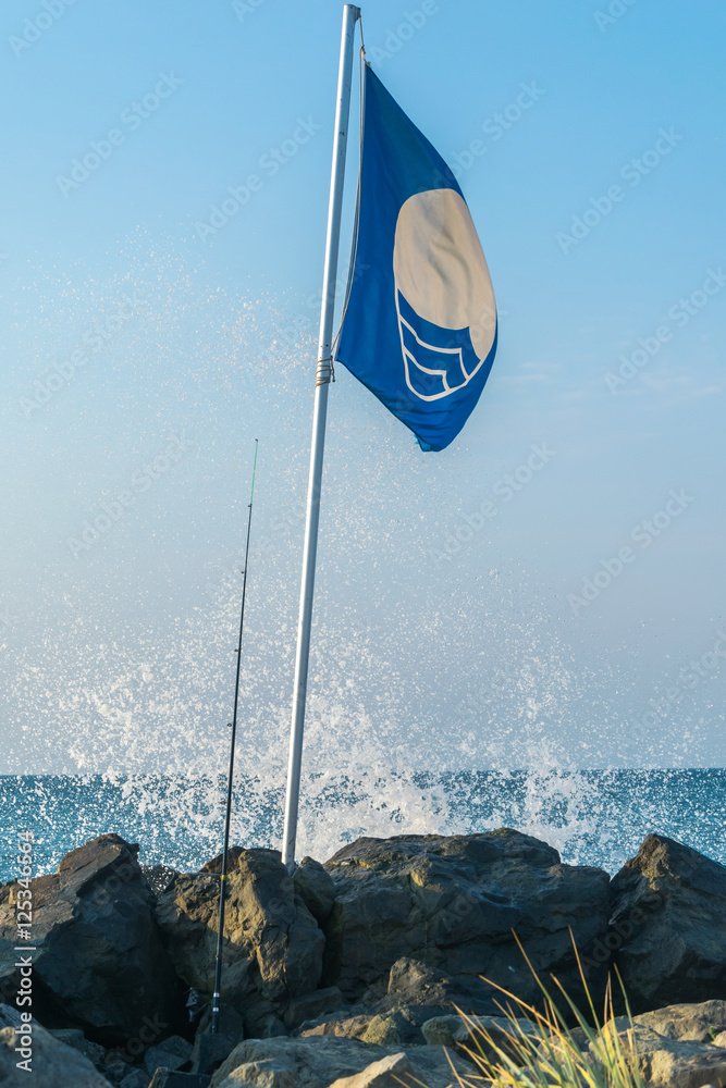 Blue Flag against blue sky. Blue Flag is an international award given ...