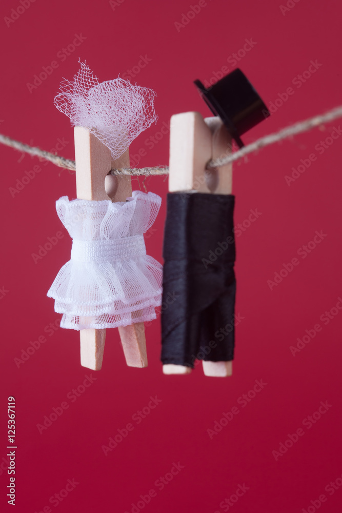 Peg characters on pink red background. Bride in white dress and groom ...