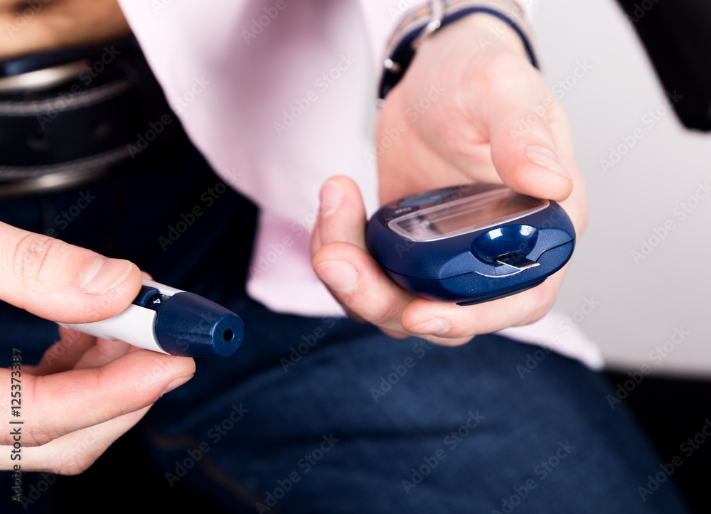 Measuring glucose level blood test using ultra mini glucometer and ...
