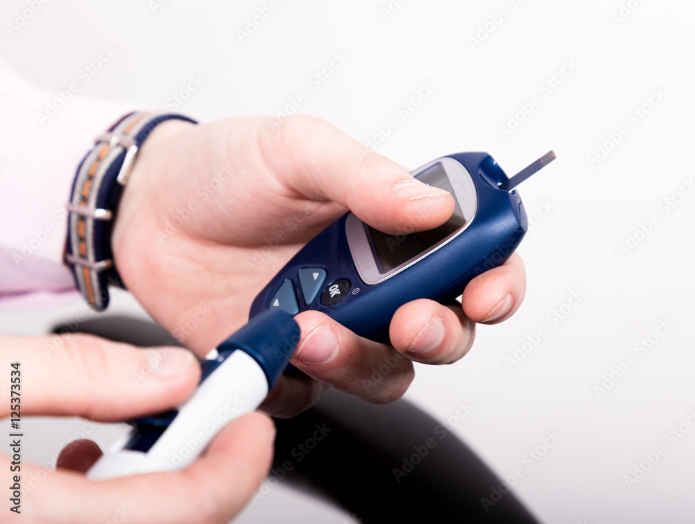 Measuring glucose level blood test using ultra mini glucometer and ...