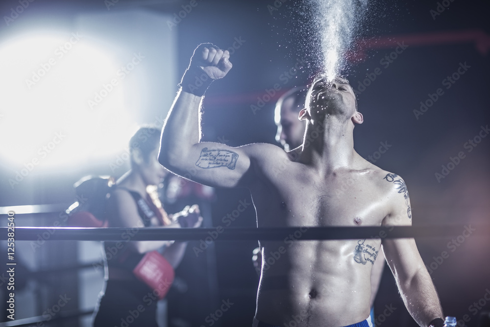 Boxer celebrating after win in boxing ring Stock Photo | Adobe Stock