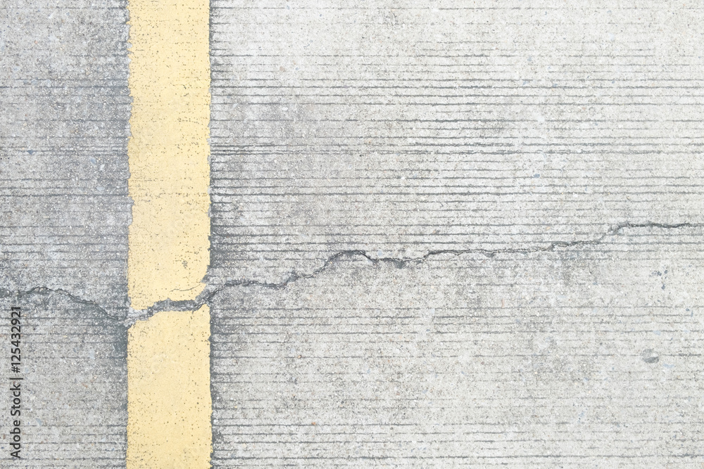 Surface of yellow line on the broken concrete street/road. background ...