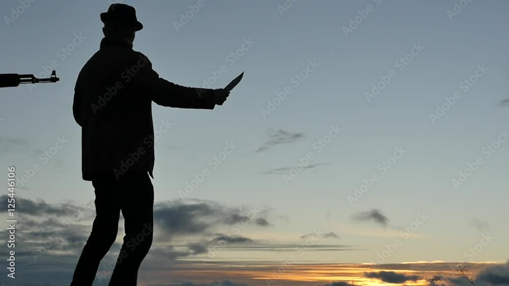 Man looking like gangster raising the hands and dropping a knife pushed ...