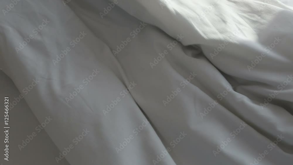 white blanket on bed being pulled slowly out of frame Stock Video ...