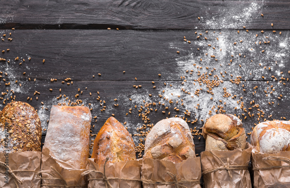 Bread bakery background. Brown and white wheat grain loaves composition ...
