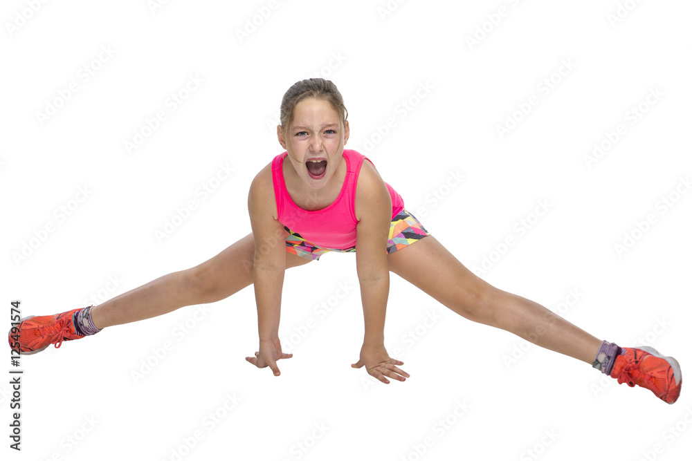 Young girl doing a painful stretching excercise on white background ...