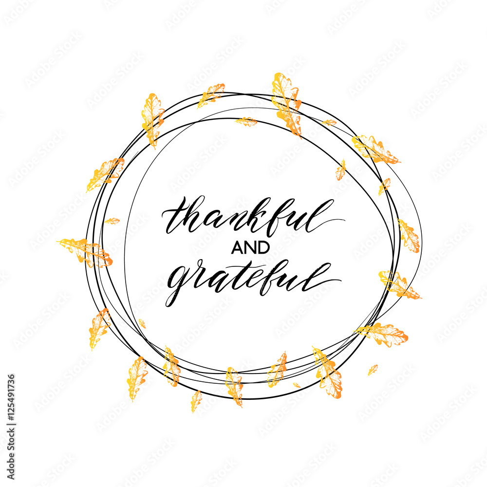 Thankful and grateful text in autumn wreath with orange leaves isolated ...