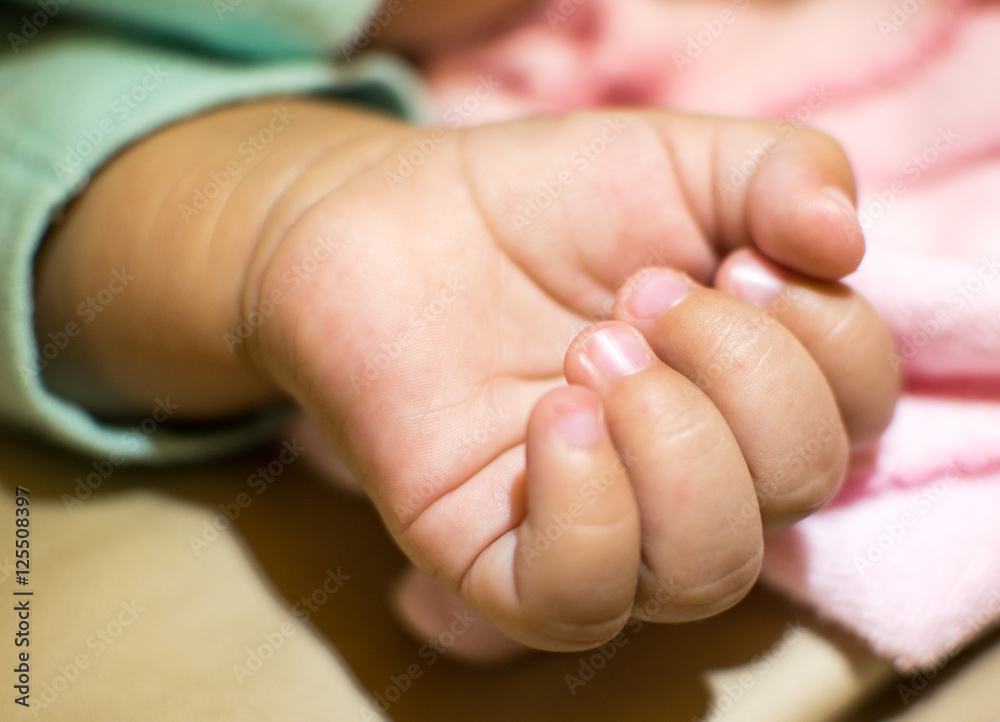 Infant Child Hand Clenched Fist Stock Photo | Adobe Stock