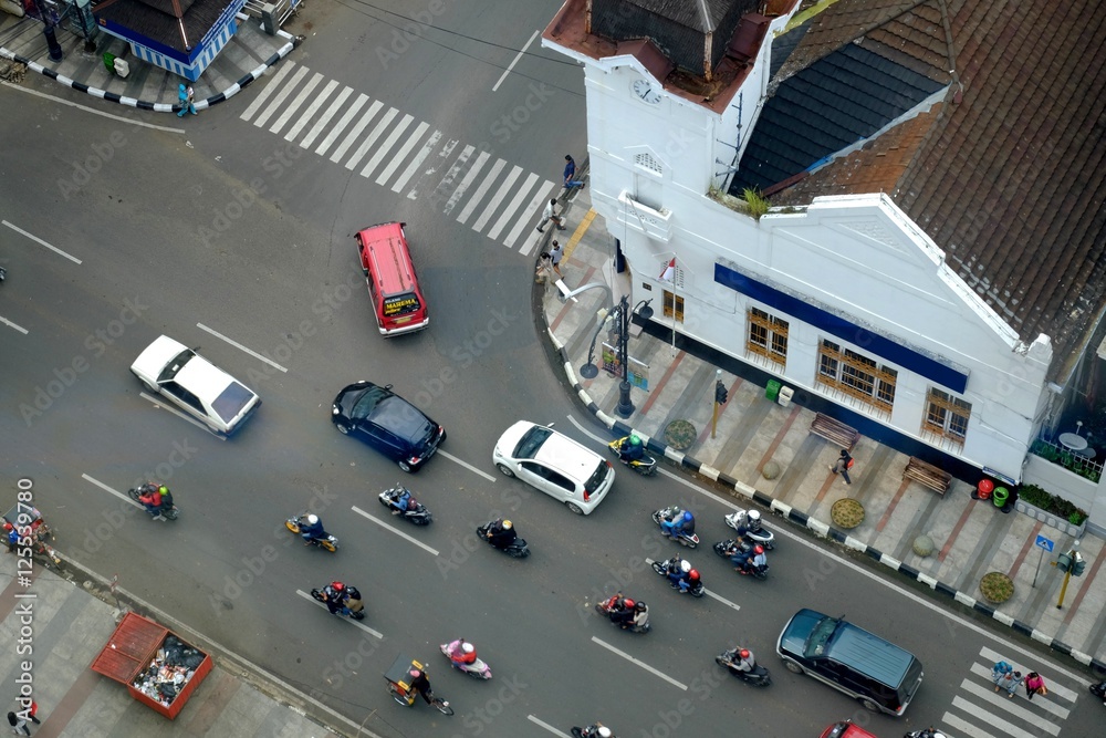 Traffic intersection with cars and motorcycles, in asia afrika street ...