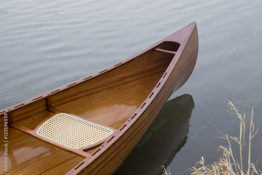 new Canoe floating on the calm water in winter sunset Stock-Foto ...