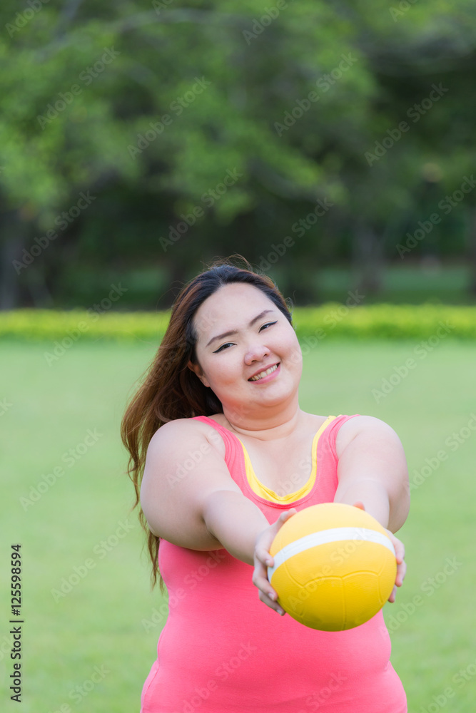 Beautiful fat woman playing dodgeball in the park. Stock Photo | Adobe ...
