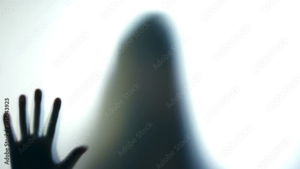 Hysterical crazy woman pounding on glass, spooky silhouette, horror ...