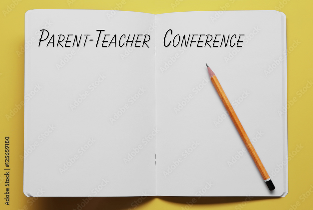 Text PARENT-TEACHER CONFERENCE written in notebook. Yellow background ...