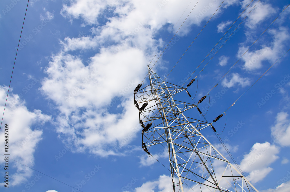 High voltage power lines with electricity pylons at blue sky. Stock ...