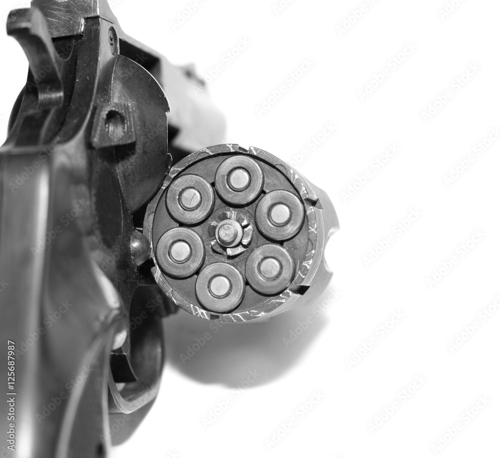 Revolver with bullets close-up isolated on white background / black and ...