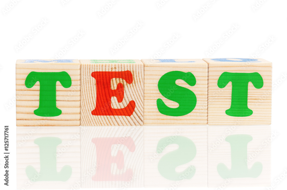 Test word formed by colorful wooden alphabet blocks, isolated on white ...