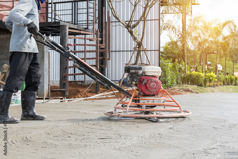 Power trowel machine and construction worker - concrete floor of Stock ...