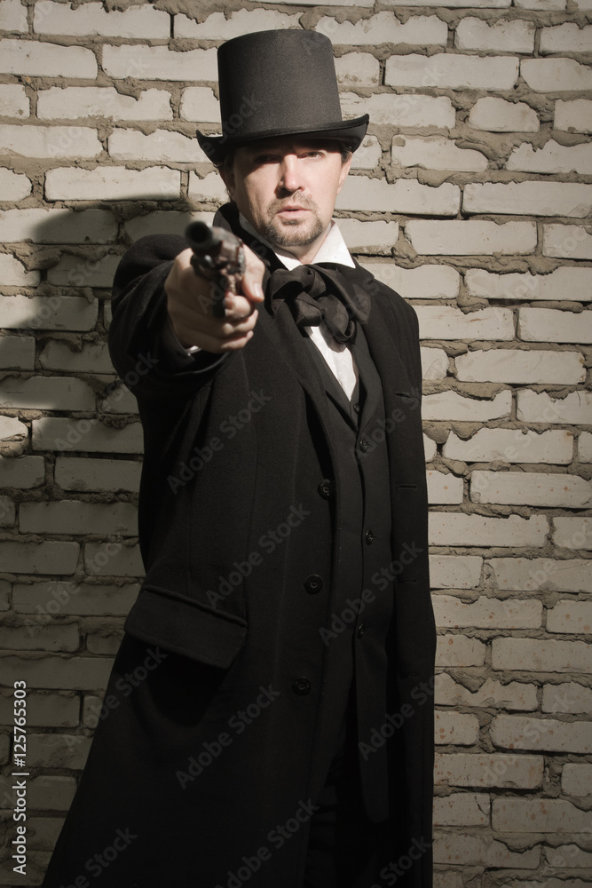 Fotografia do Stock: Victorian style man with old gun | Adobe Stock