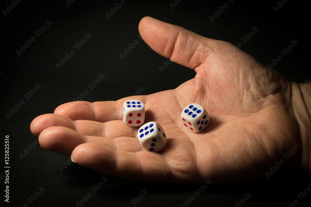 dice in hand Stock Photo | Adobe Stock