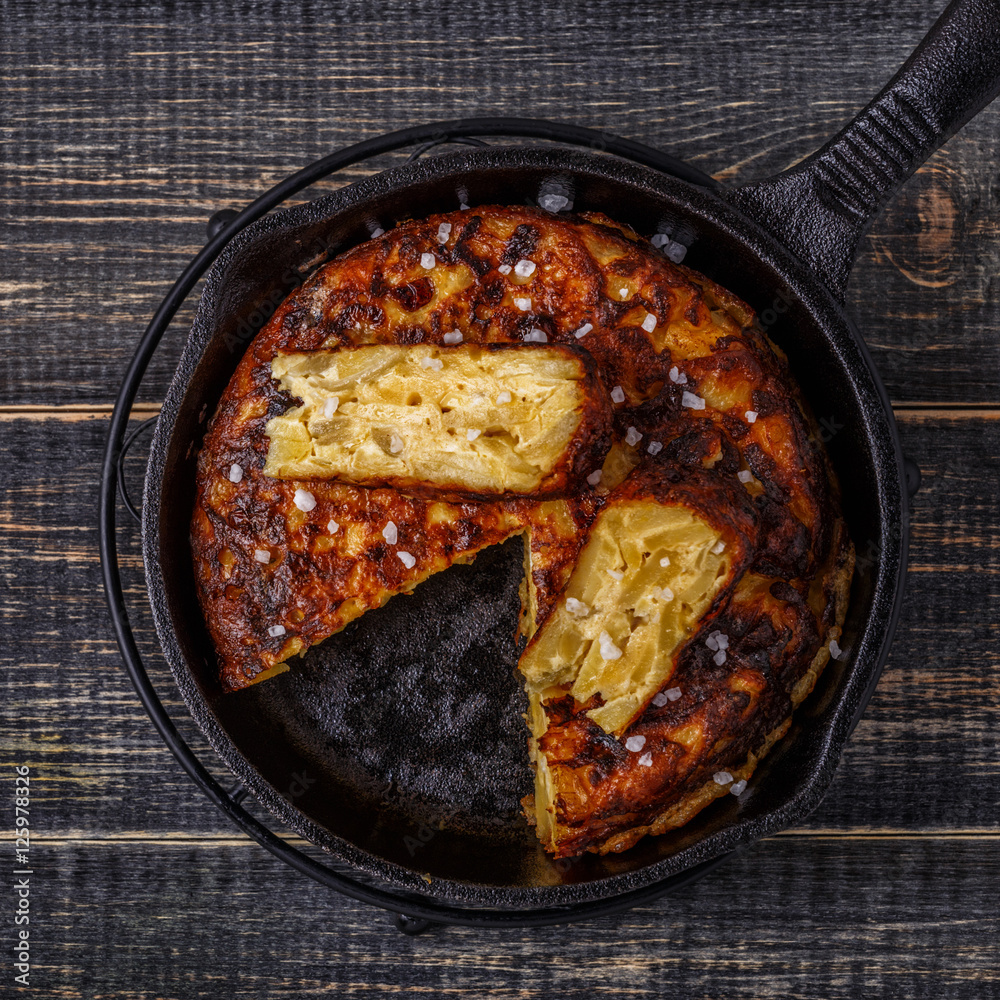 Spanish tortilla in a frying pan. Stock Photo | Adobe Stock
