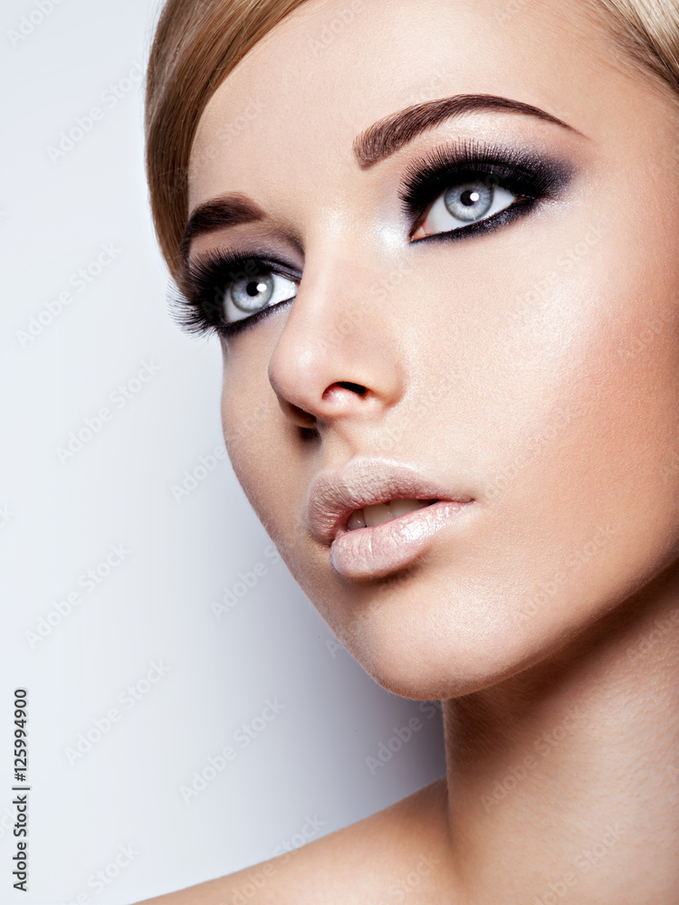 Portrait of fashion model with black makeup of eyes. Pretty at Stock ...
