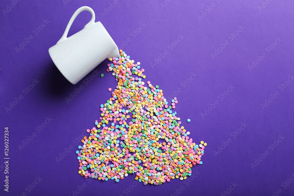 Colorful sprinkles with white jug on the purple background Stock Photo ...