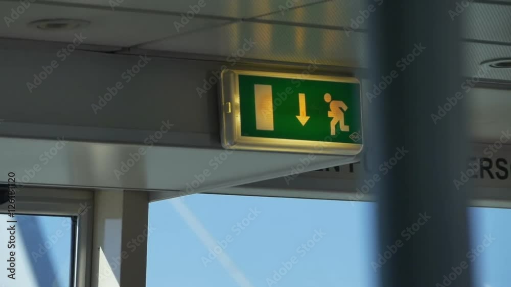 Vidéo Stock Emergency exit sign for passengers on a large river boat ...