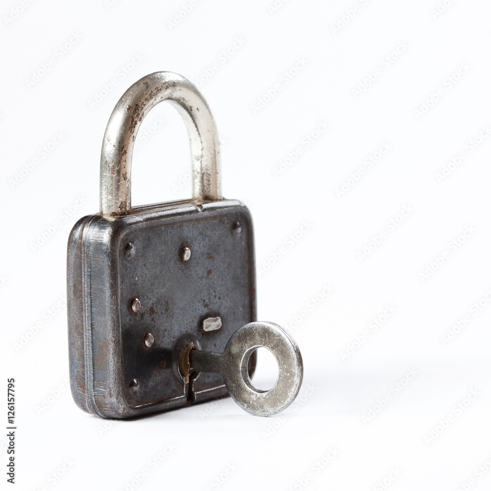 Vintage padlock with key in hole. hanging lock close-up. texture and ...