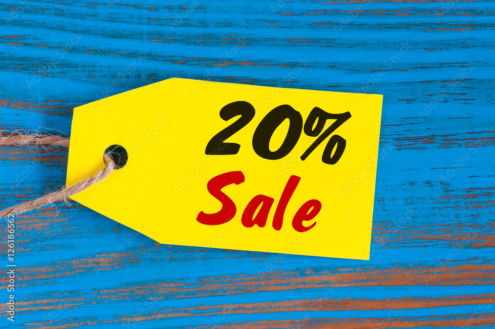sale minus 20 percent. Big sales 20%, twenty percents on blue wooden ...
