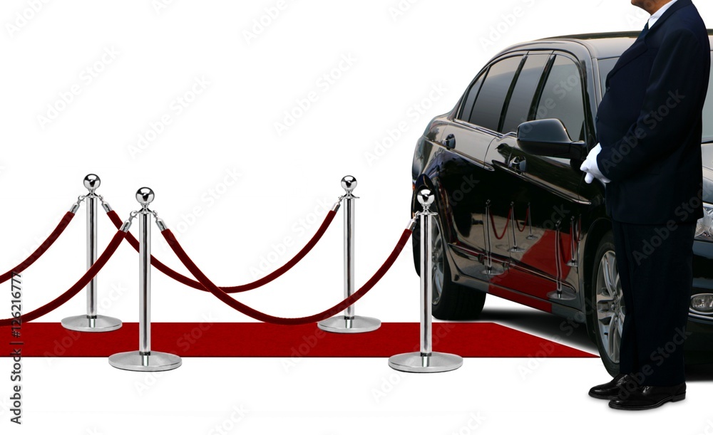 Driver waiting and standing next to the limousine Stock Photo | Adobe Stock