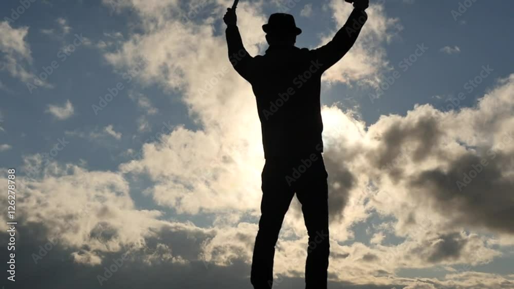 Man surrender - raise hands and dropping weapons silhouette slow motion ...