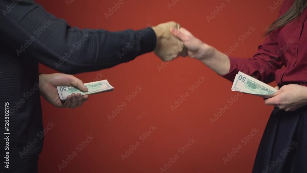 Man Counts A Packs Of 50 Dollars Banknotes And Making Payment By Cash man-counts-a-packs-of-50-dollars-banknotes-and-making-payment-by-cash