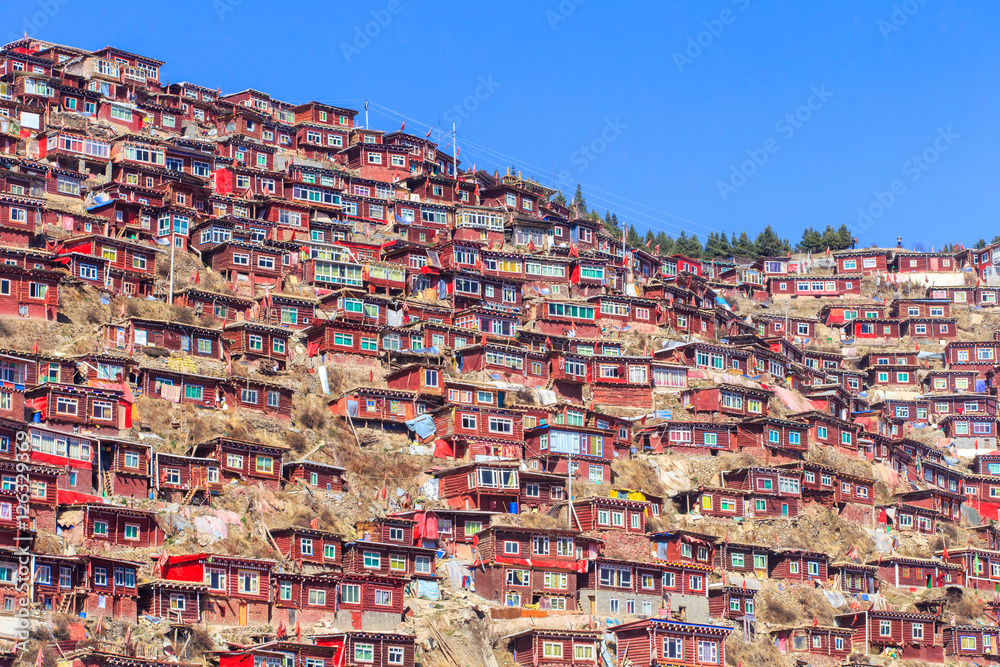 Red monastery at Larung gar (Buddhist Academy) in sunshine day and ...