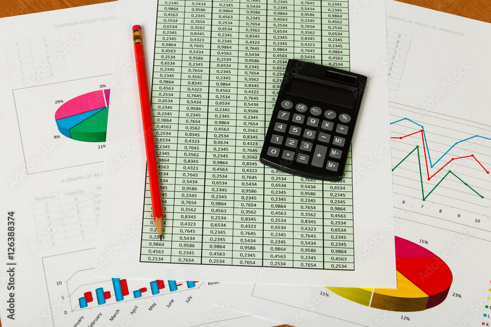 Calculator, pencil, drawings and calculations on desktop background ...