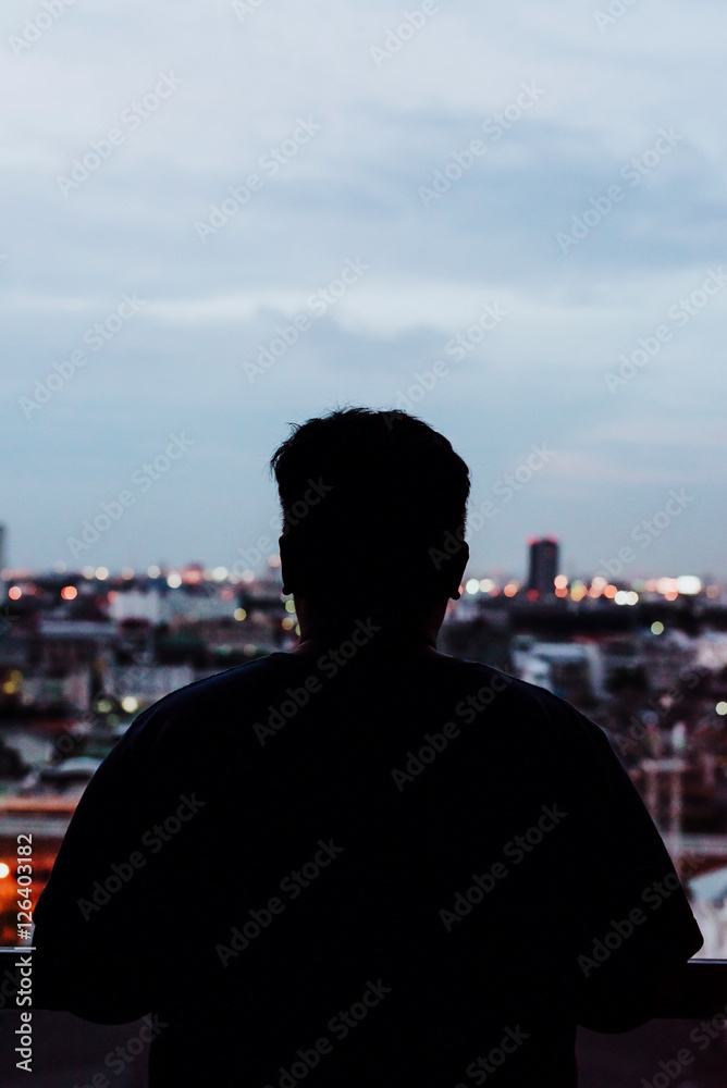 Man watching the view from skyscraper. Contours of the man to ...