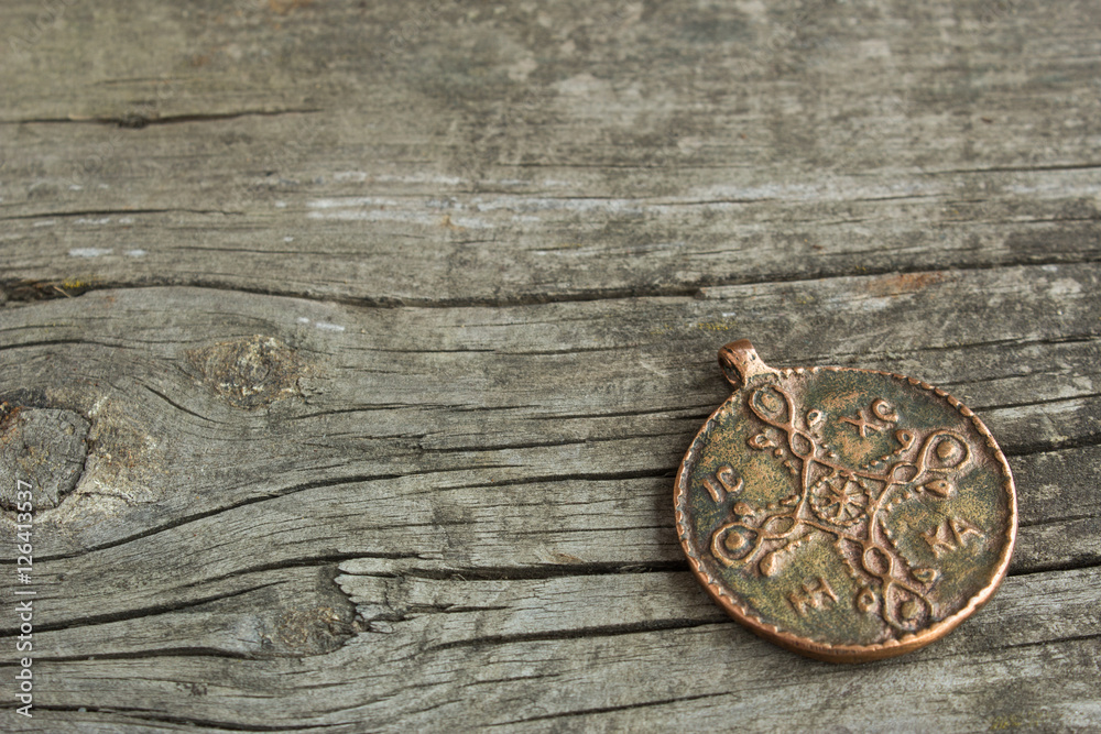 old copper coin pendant with the symbol of saint and cross Stock Photo ...