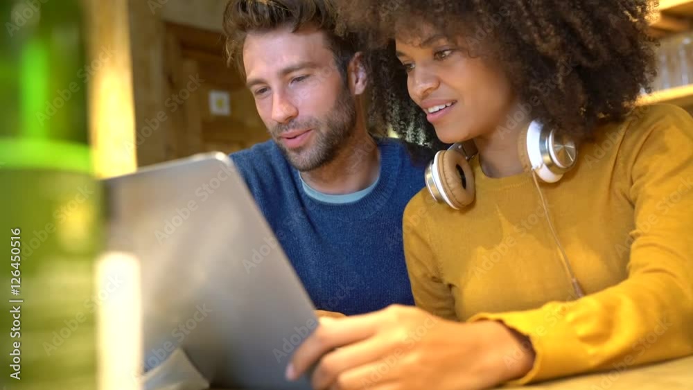 Couple in restaurant connected on internet with laptop Stock Video ...