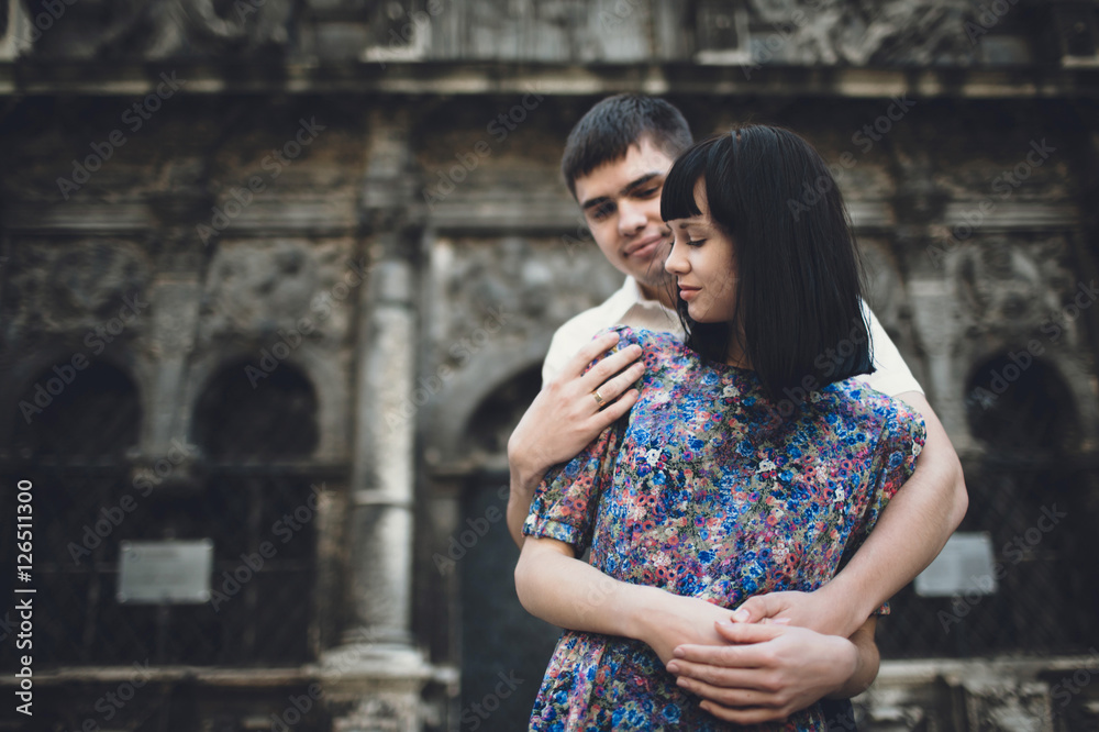 Emotional embracement of the couple in front of the church Stock Photo ...