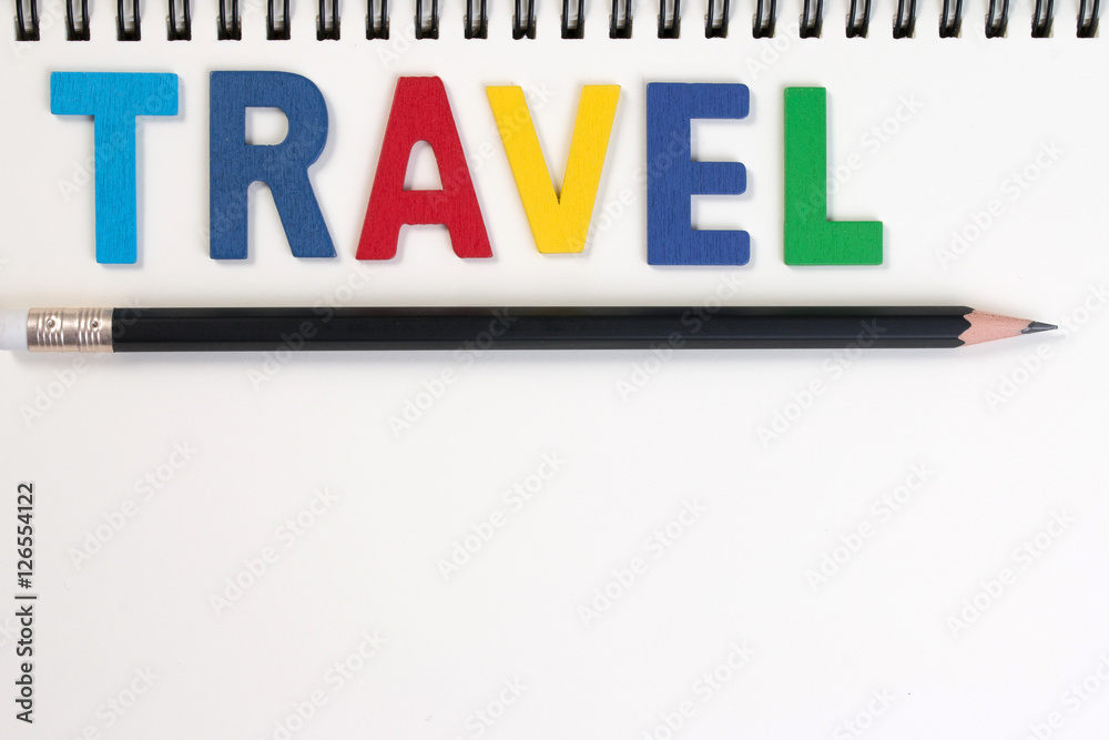 Travel word write on wooden alphabet and notebook on white background ...