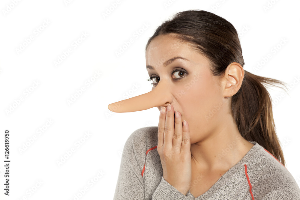 Foto Stock women with elongated nose - the concept of lying | Adobe Stock