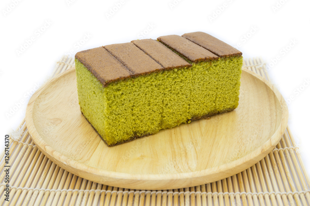 Japanese Matcha green tea cake cheesecake on wooden plate and ...