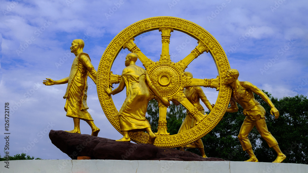 Golden Wheel of Dhamma on sky clouds (Dharmachakra ) Thai Art in public ...